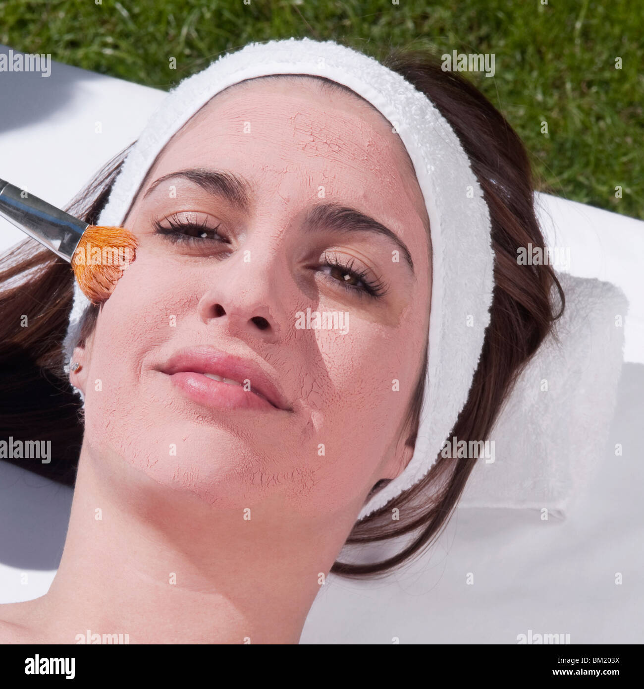 Woman applying a facial mask Stock Photo - Alamy