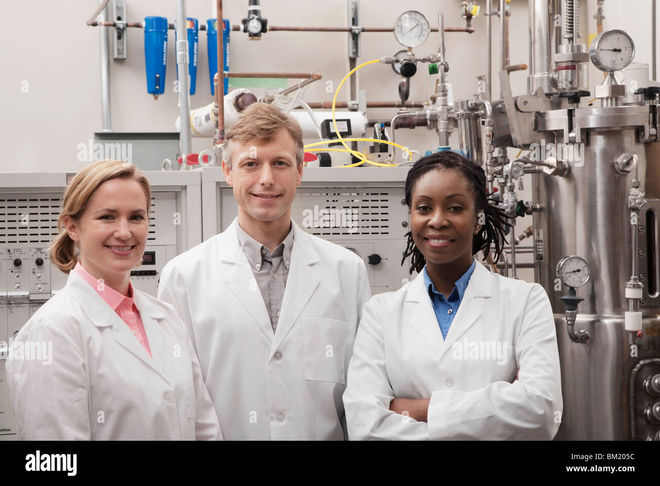Portrait of three doctors in a laboratory Stock Photo - Alamy