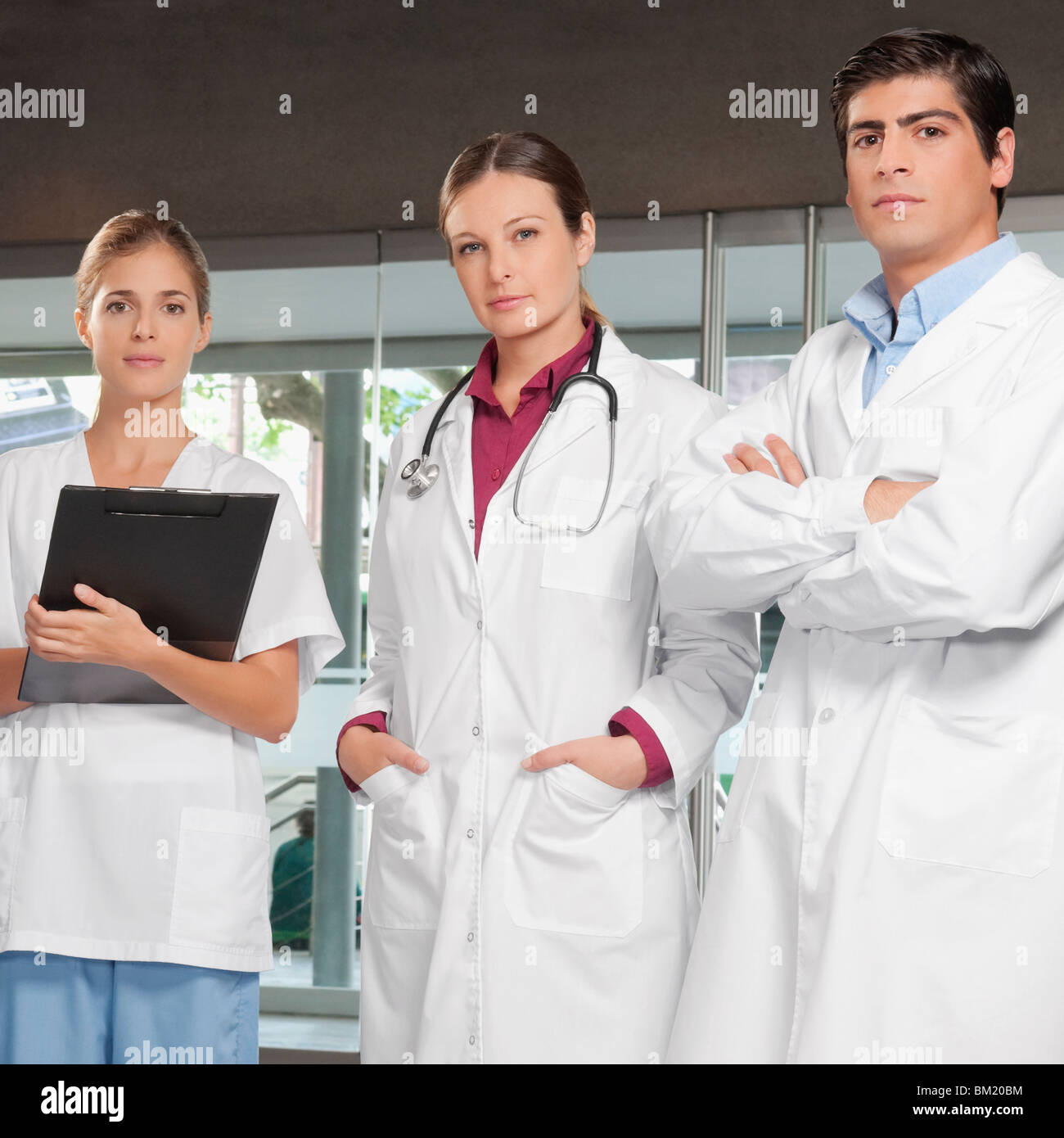 Portrait of three doctors standing together Stock Photo - Alamy