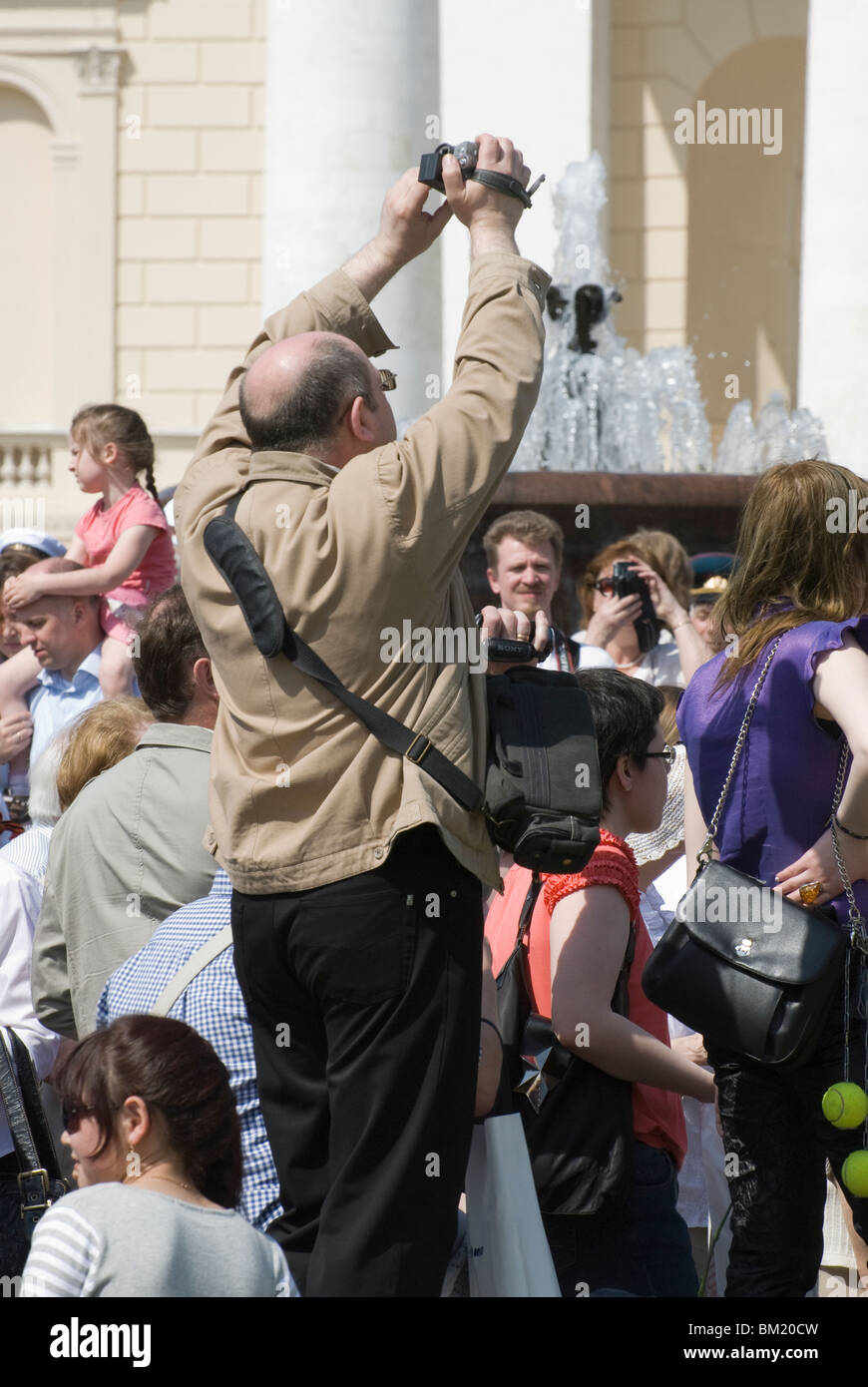 A man with compact video camera Stock Photo - Alamy