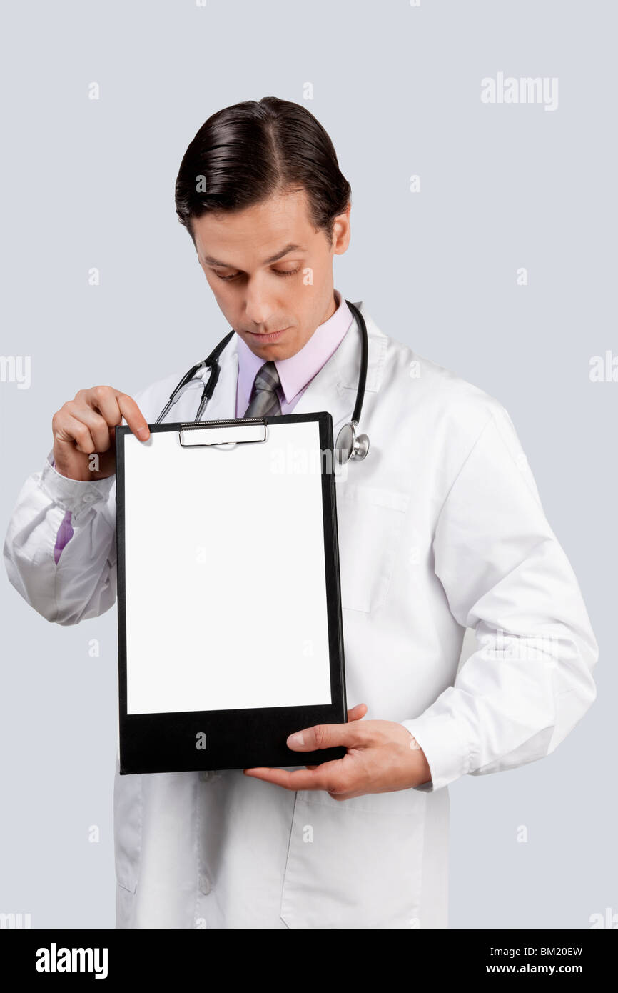 Doctor holding a clip board Stock Photo - Alamy