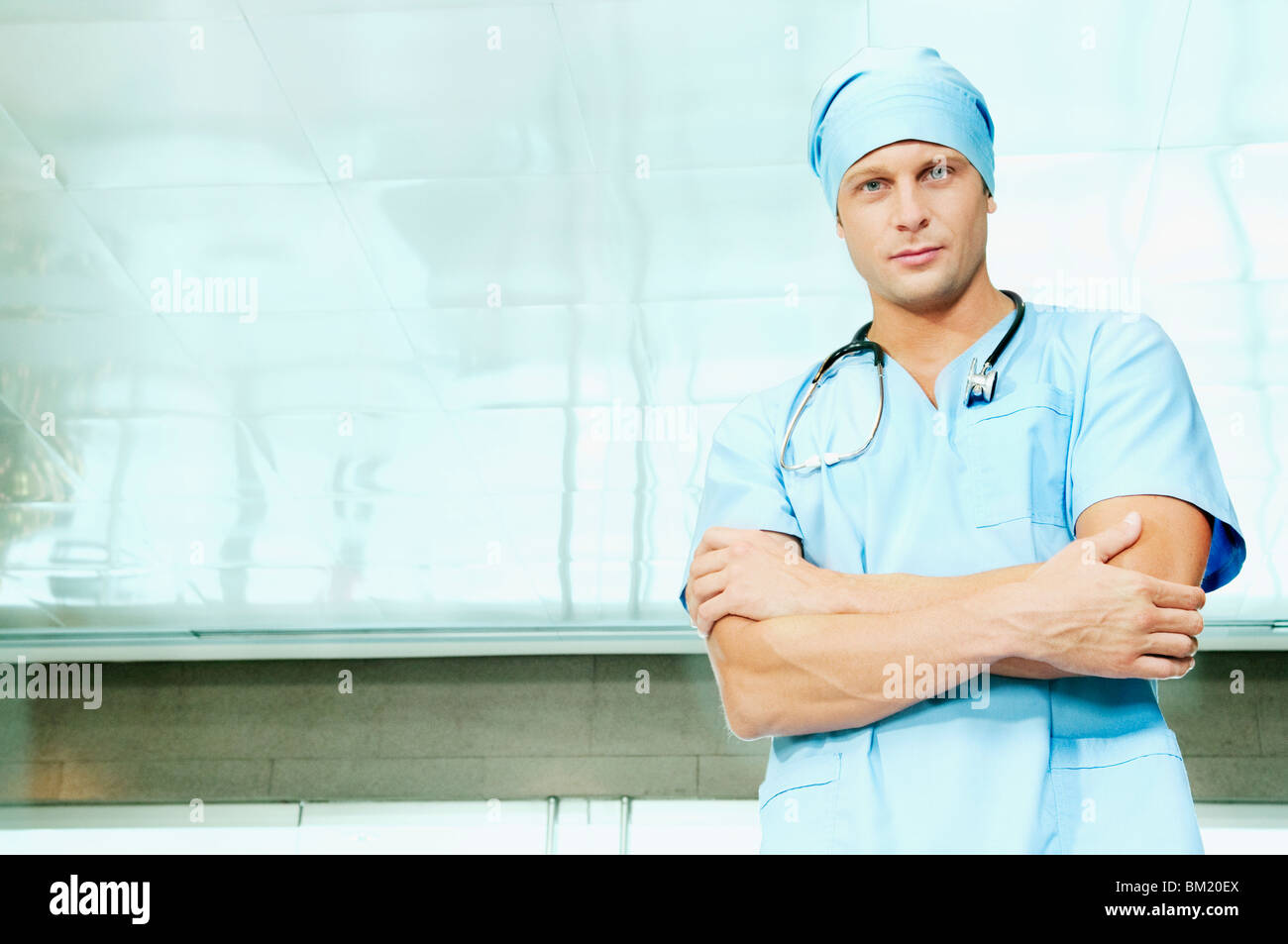Portrait of a male surgeon standing with his arms crossed Stock Photo ...