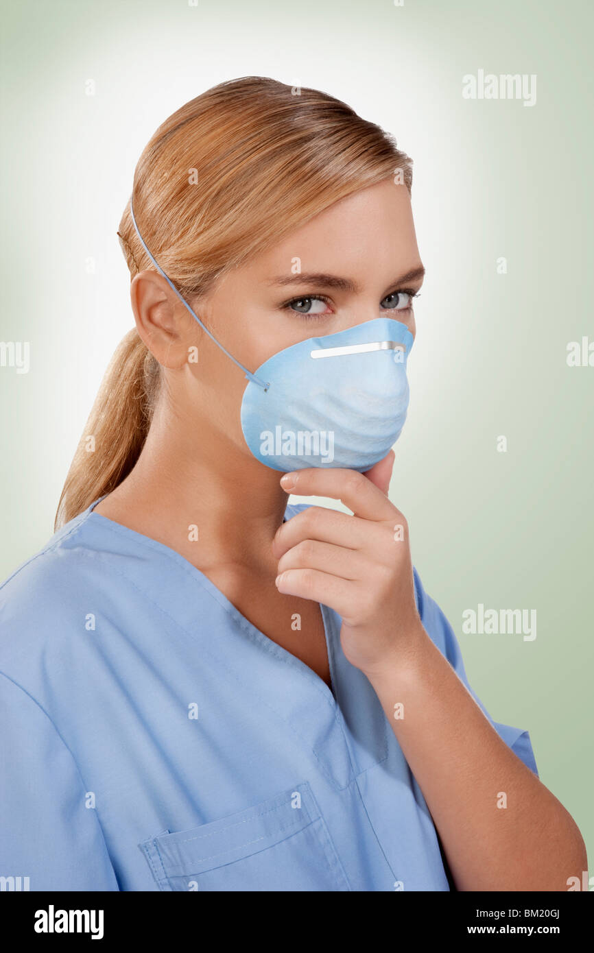 Female nurse wearing a flu mask Stock Photo - Alamy