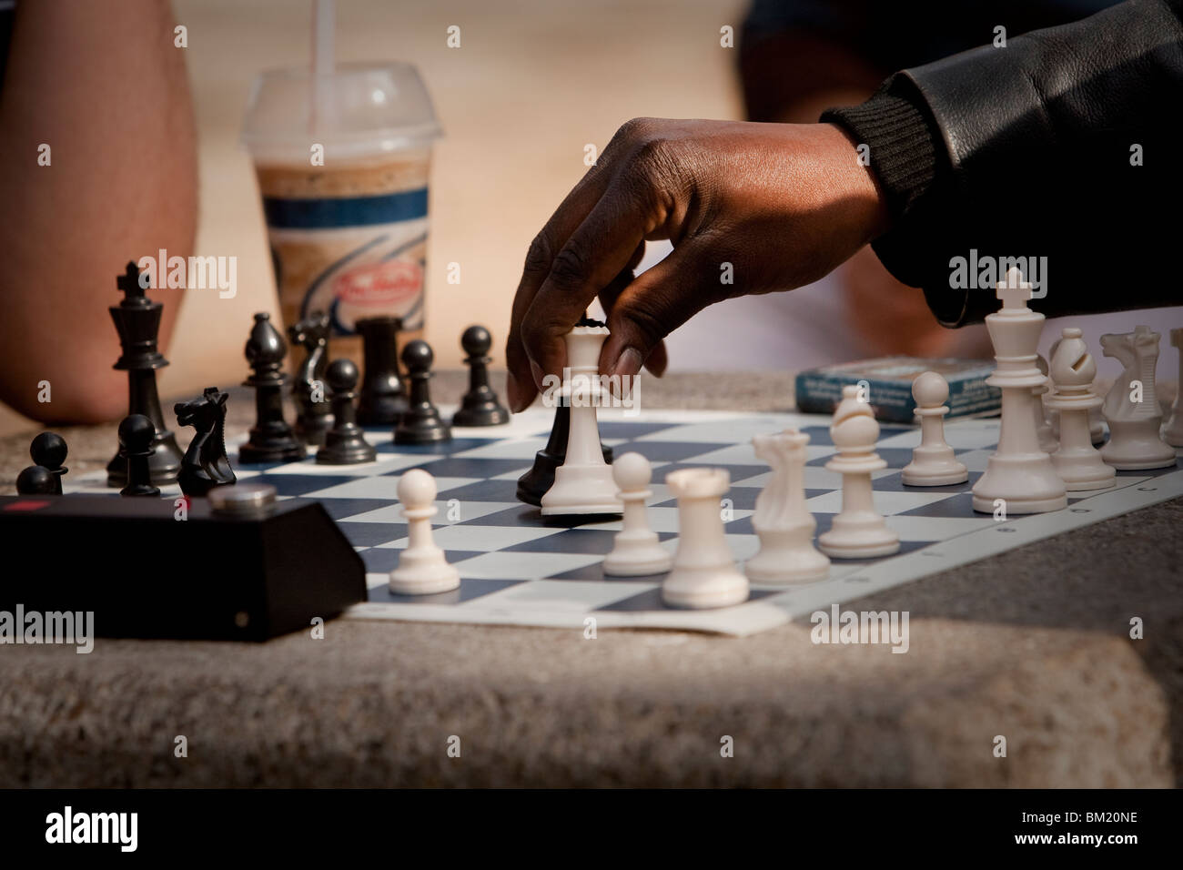 2 man play chess in a park at the corner of Church and Queen street in ...