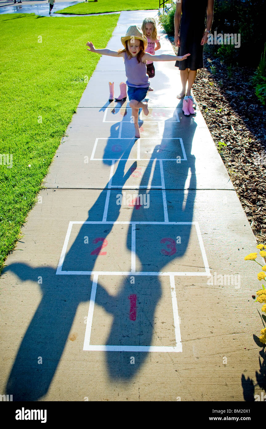 Children playing hopscotch in footpath hi-res stock photography and ...