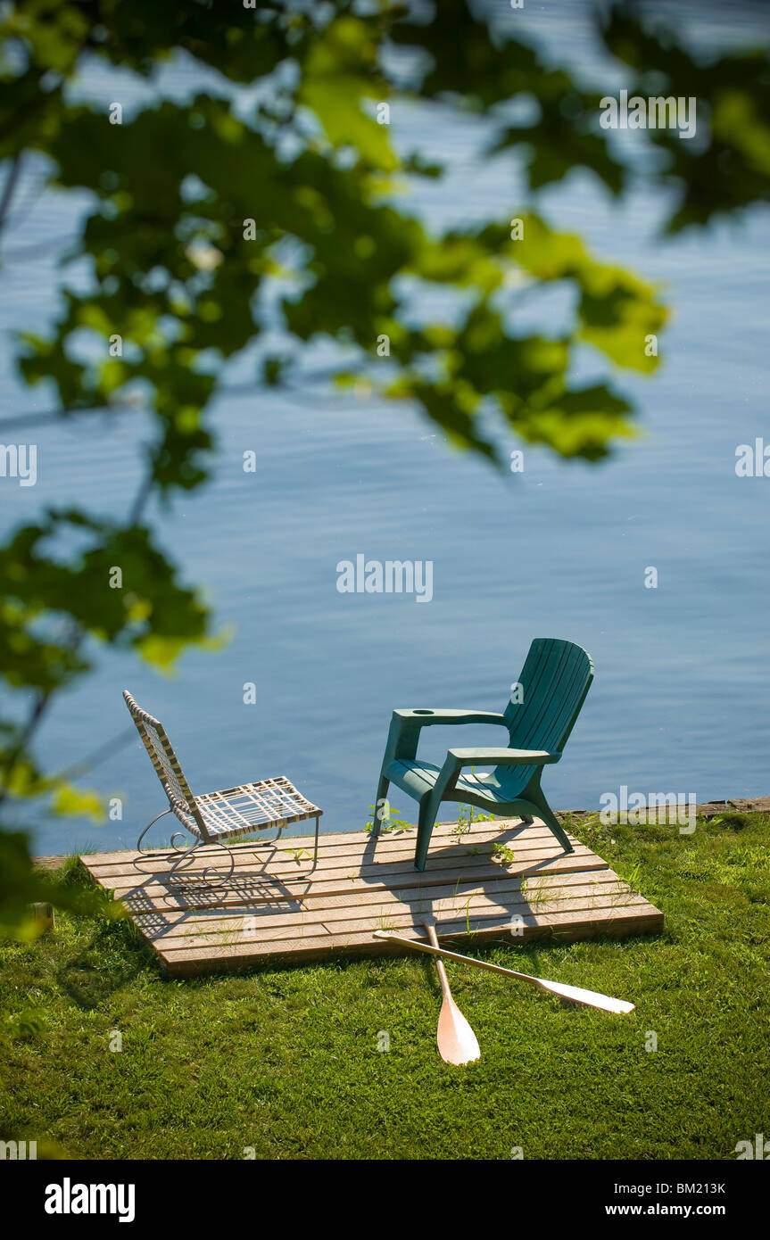 Two chairs and oars at the lakeside, Ithaca, New York State, USA Stock ...