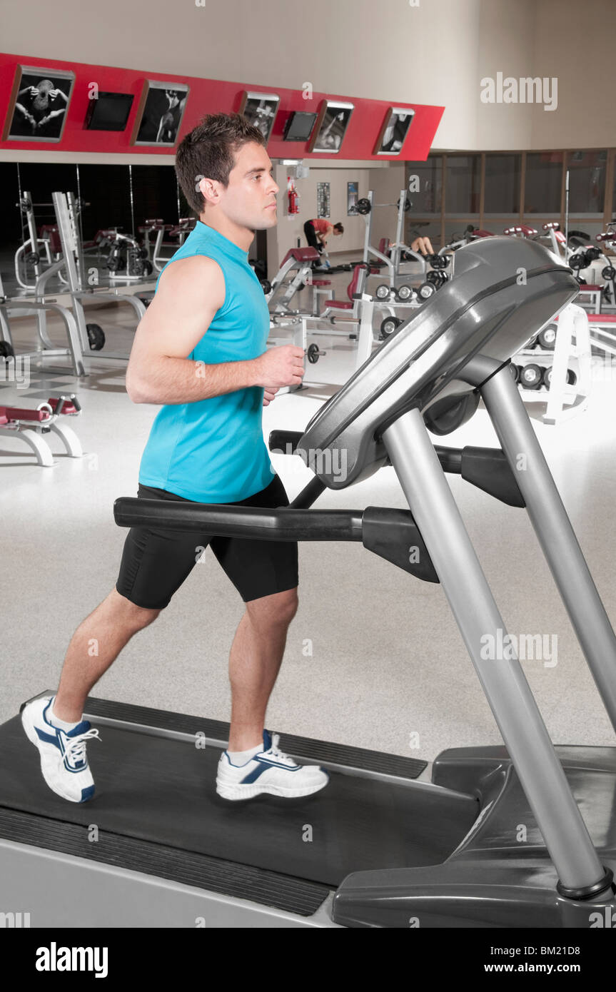 Man running on a treadmill Stock Photo - Alamy