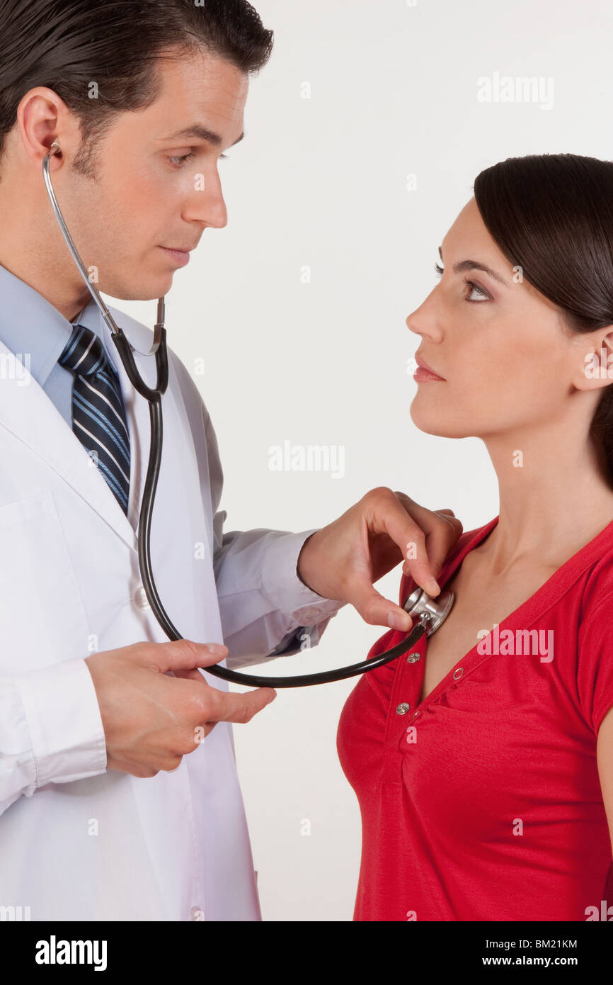 Doctor examining woman hi-res stock photography and images - Alamy