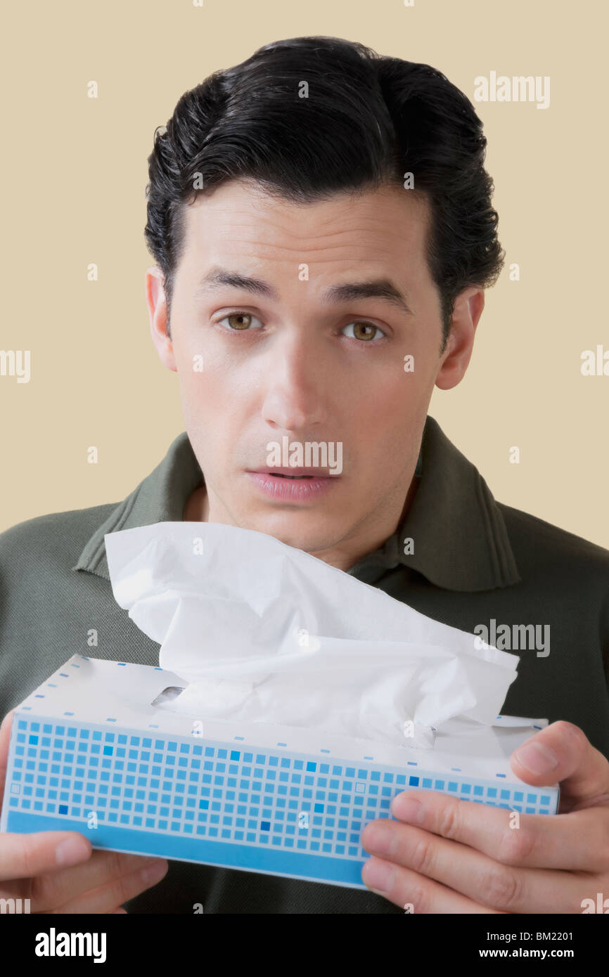Man holding a tissue paper box Stock Photo - Alamy