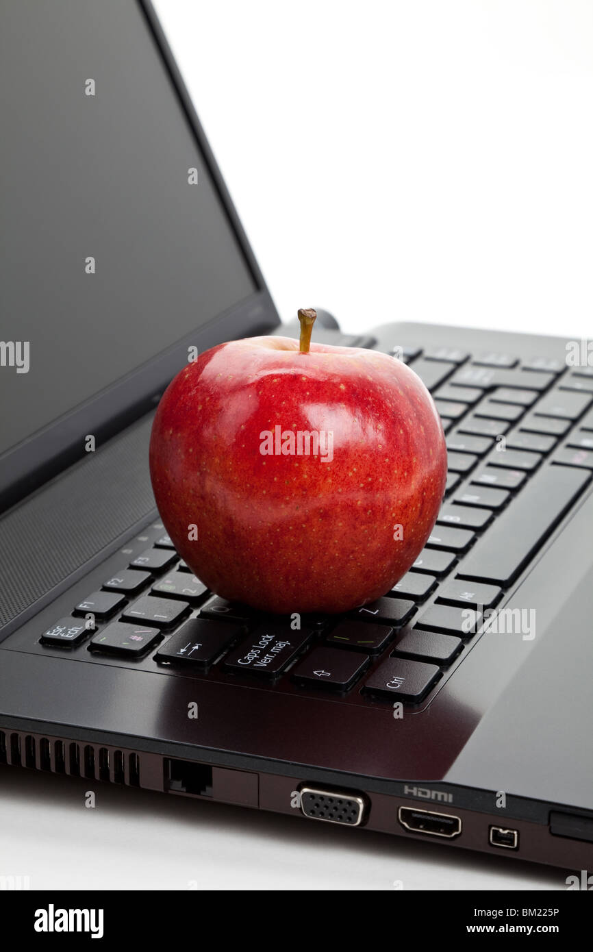 Computer Keyboard and red apple close up Stock Photo - Alamy