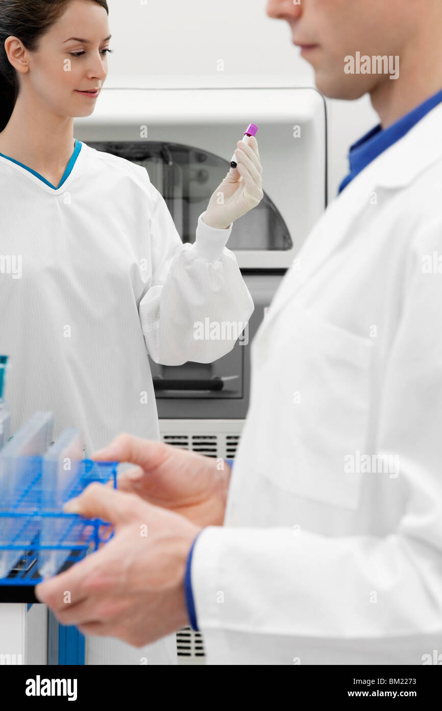 Female doctor holding a medical sample in a laboratory Stock Photo - Alamy