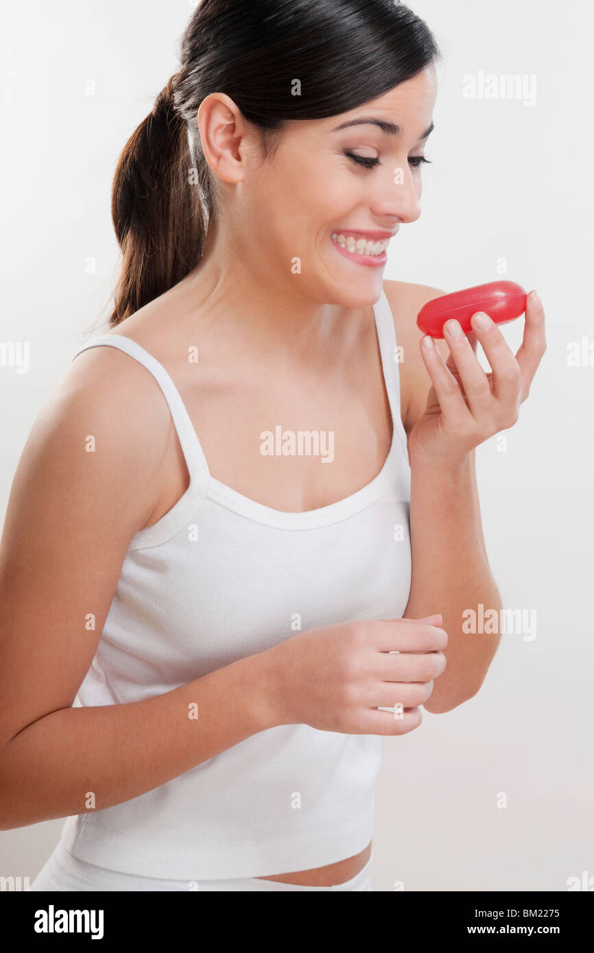 Woman holding a bar of soap Stock Photo - Alamy