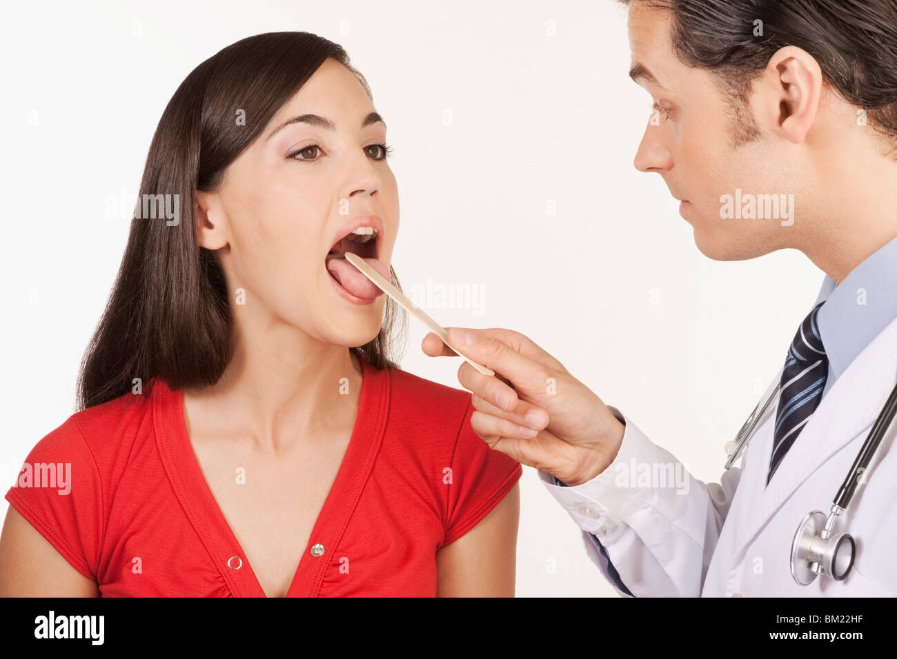 Doctor examining a woman Stock Photo - Alamy