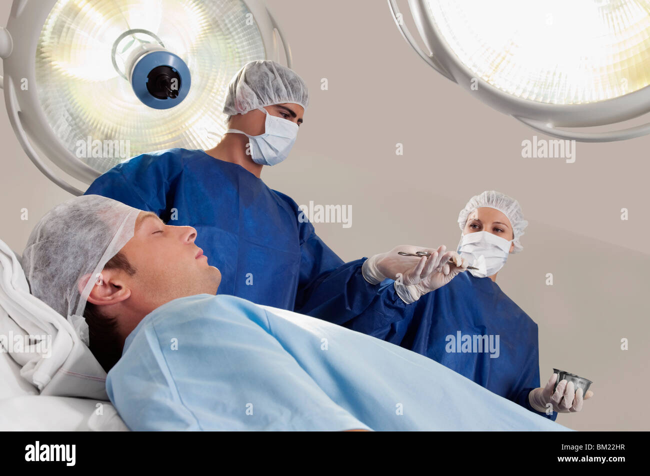 Male patient lying on operating table hi-res stock photography and ...