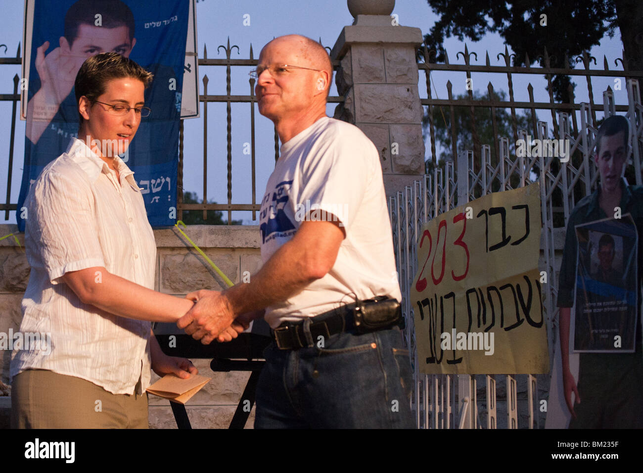 Father Noam Shalit and Tal Kfir Shor at a Sabbath welcoming ceremony ...