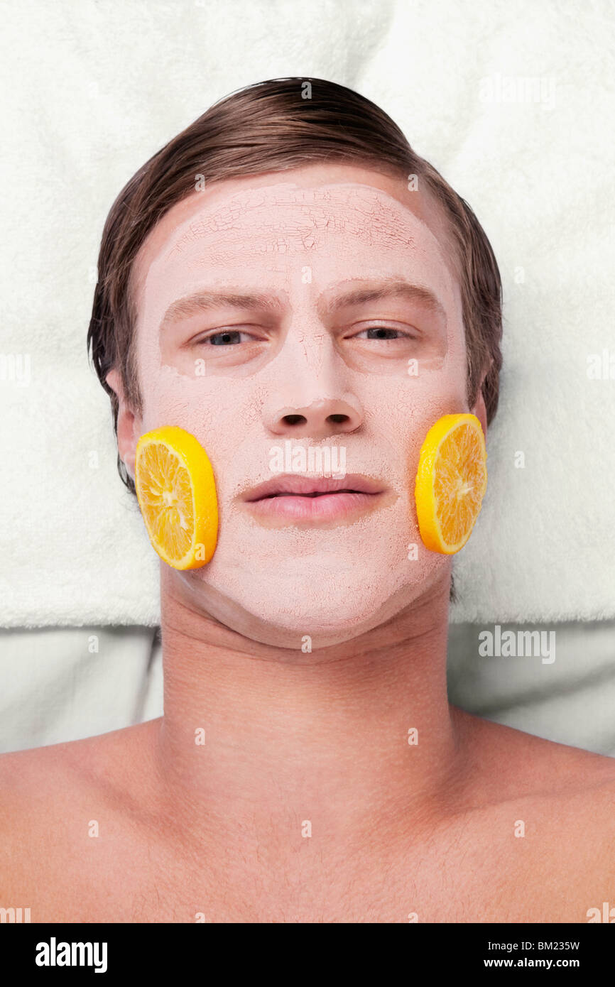 Orange slices on a man's face Stock Photo - Alamy