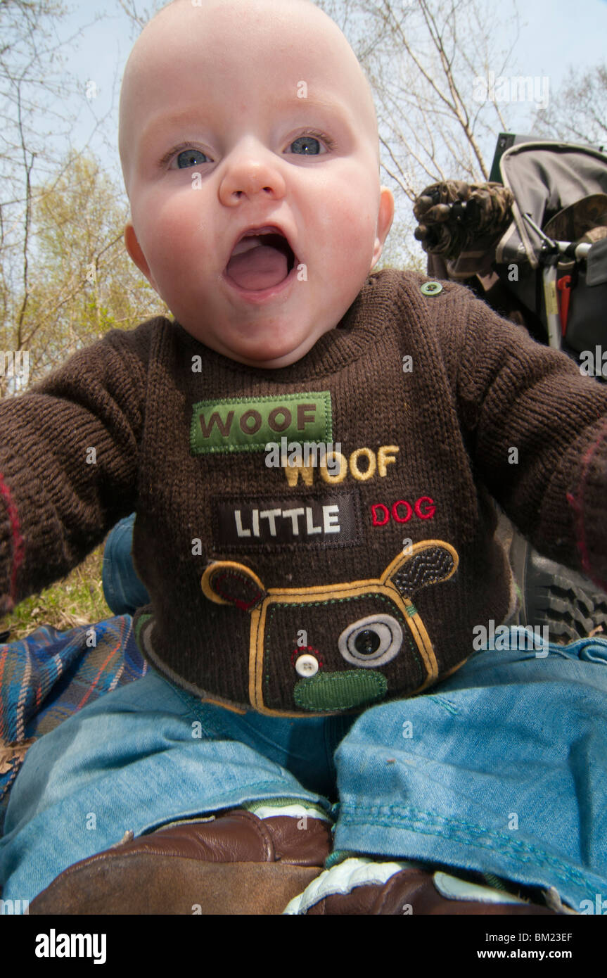 Baby grabbing camera Stock Photo - Alamy
