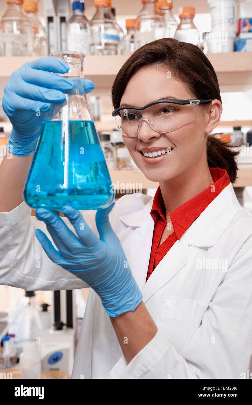 Female doctor holding a conical flask in a laboratory Stock Photo - Alamy