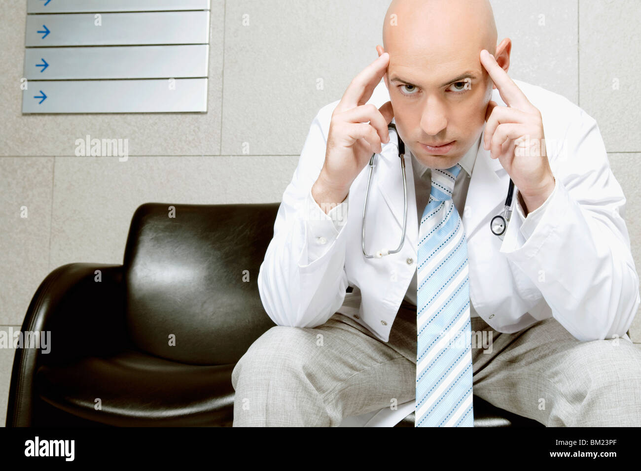 Portrait of a doctor thinking Stock Photo - Alamy