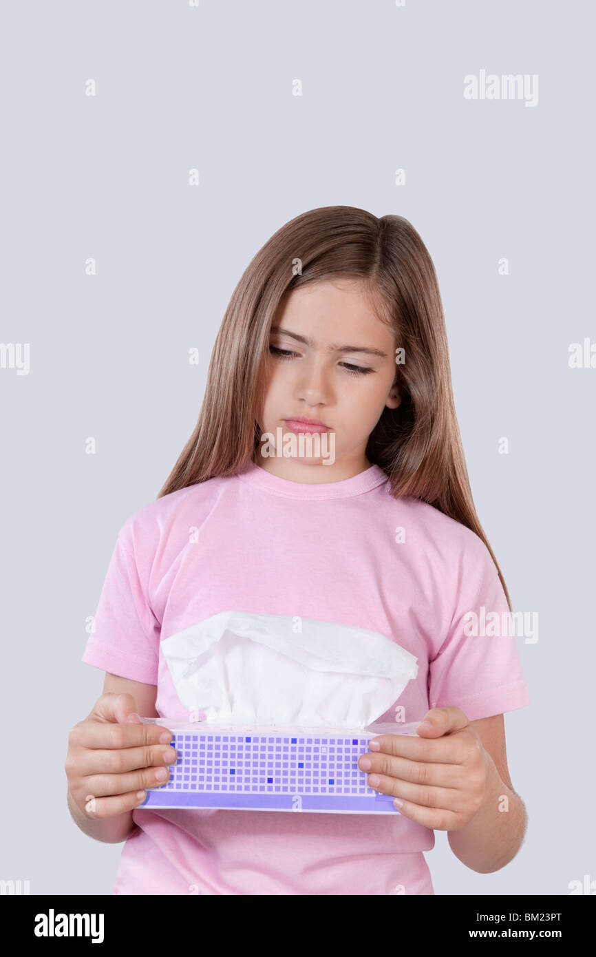 Girl holding a flu mask box Stock Photo - Alamy