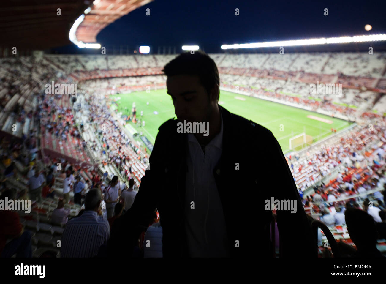 Spectator arriving to their seat Stock Photo - Alamy