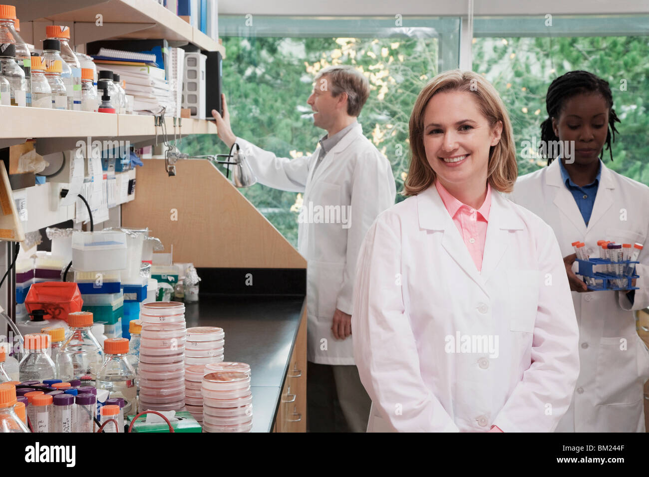 Three doctors working in a laboratory Stock Photo - Alamy