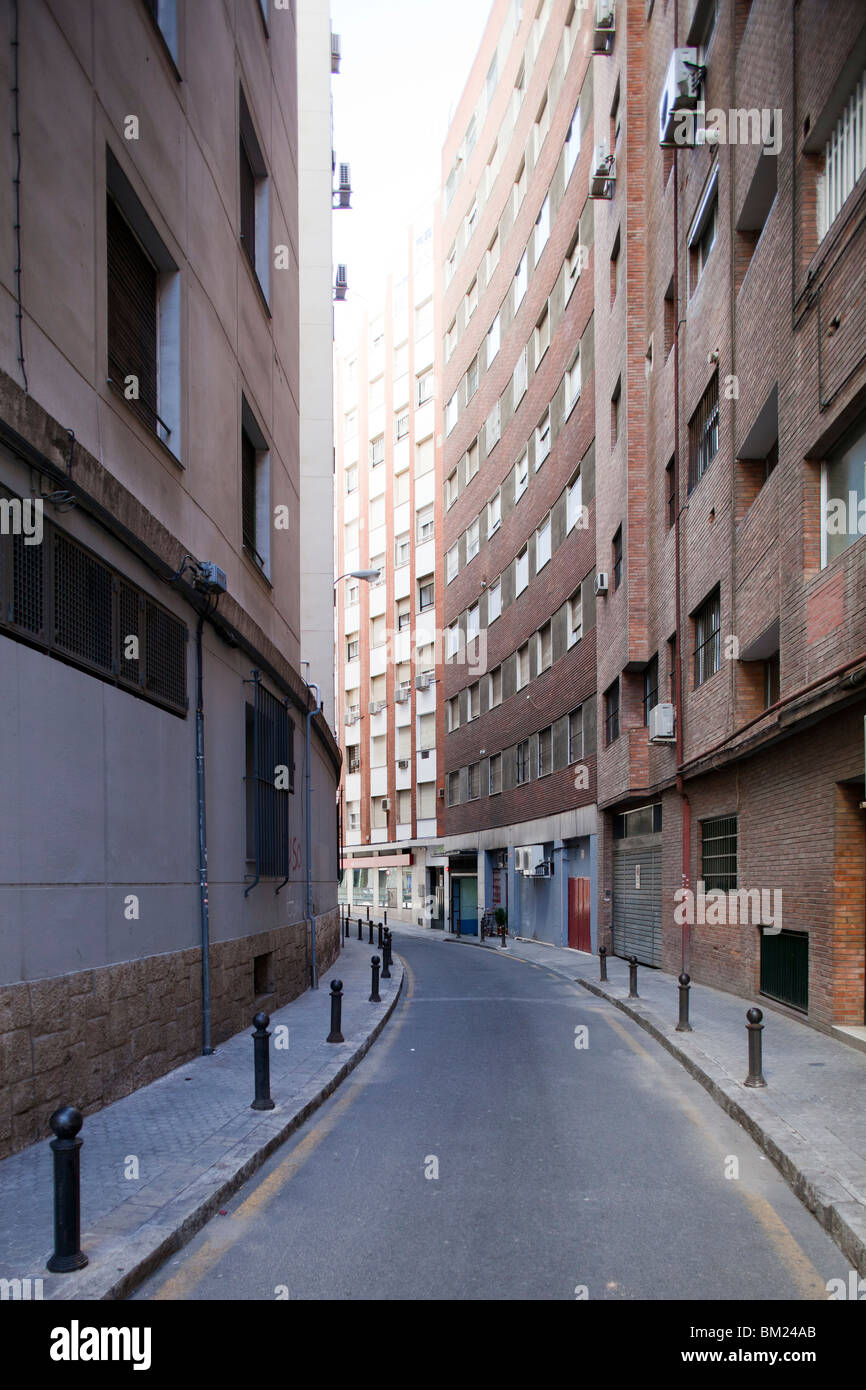 Lane between high-rise buildings, Seville, Spain Stock Photo - Alamy