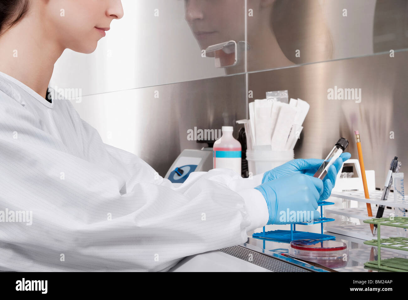 Female doctor holding a medical sample in a laboratory Stock Photo - Alamy