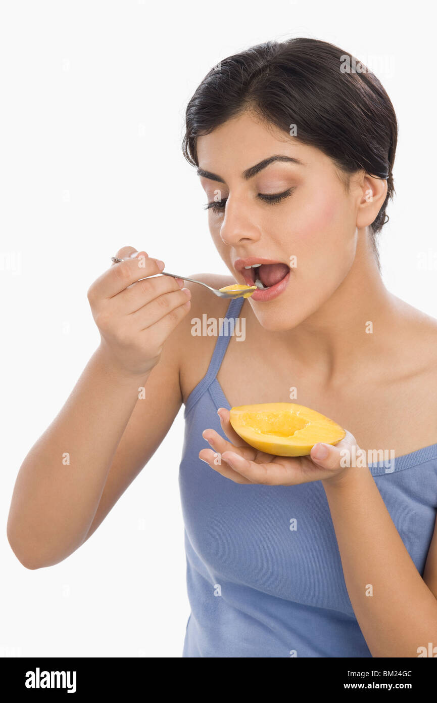 Eating mango hi-res stock photography and images - Alamy