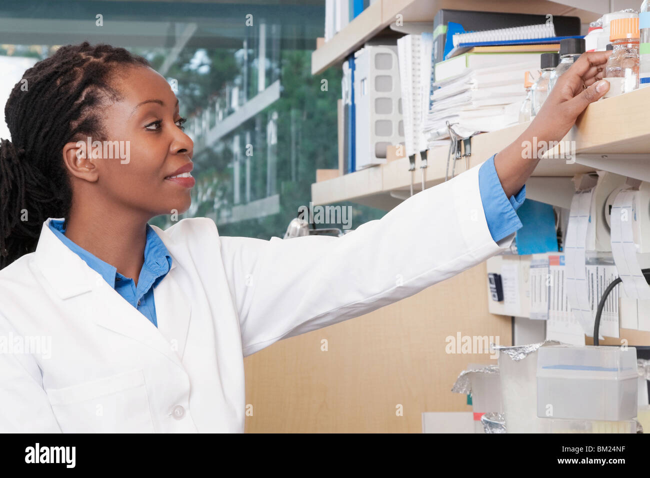Female doctor working in a laboratory Stock Photo - Alamy