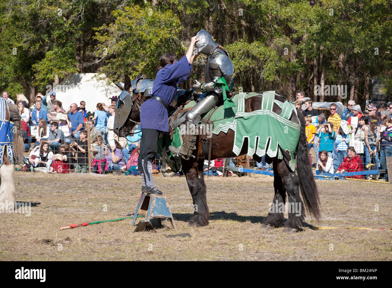 Gainesville FL - Jan 2009 - Groom helps man dressed as knight position ...