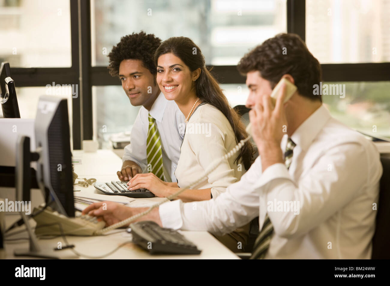 Business executives working in an office Stock Photo - Alamy