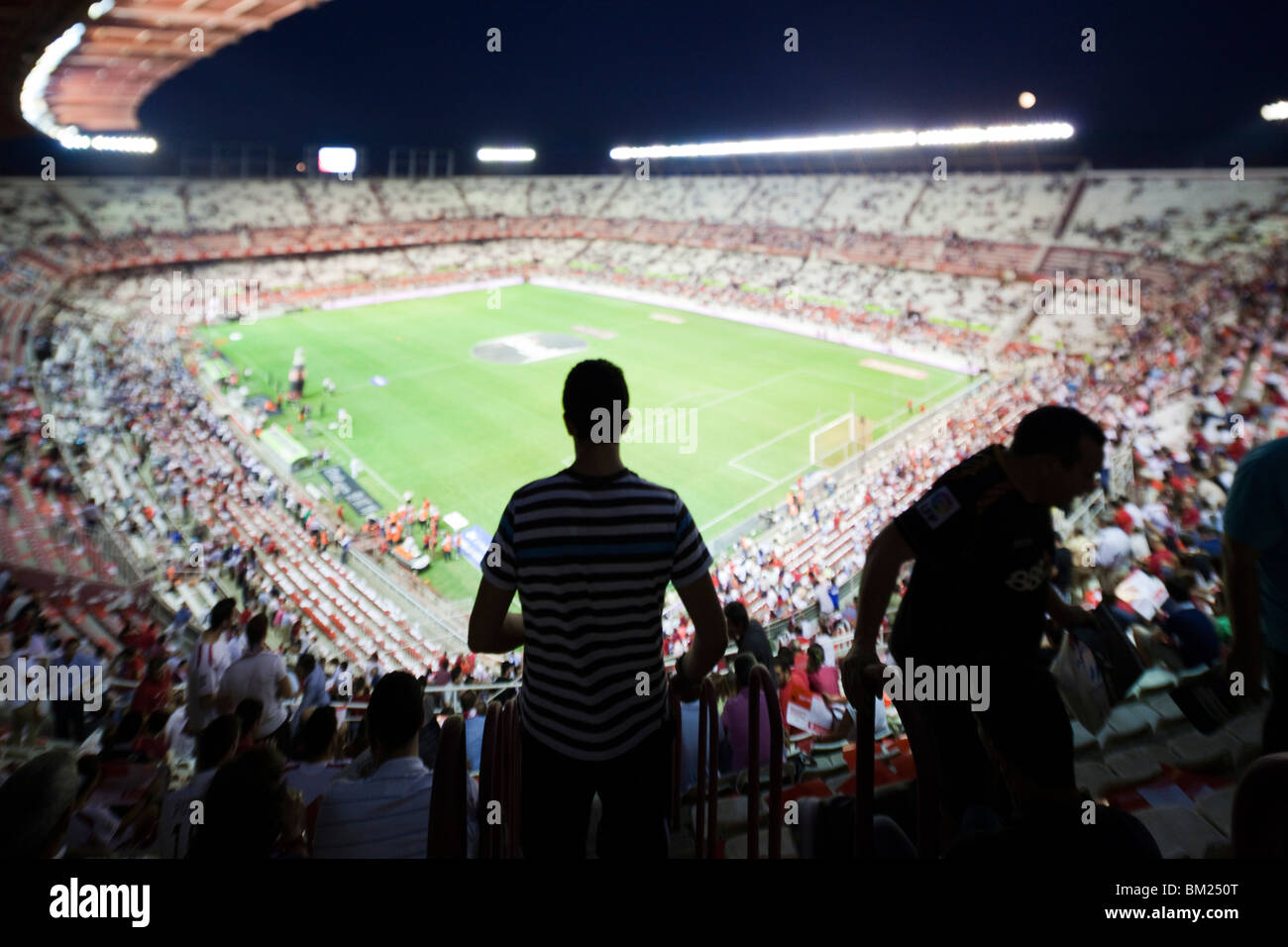 Spectator arriving to their seats Stock Photo - Alamy