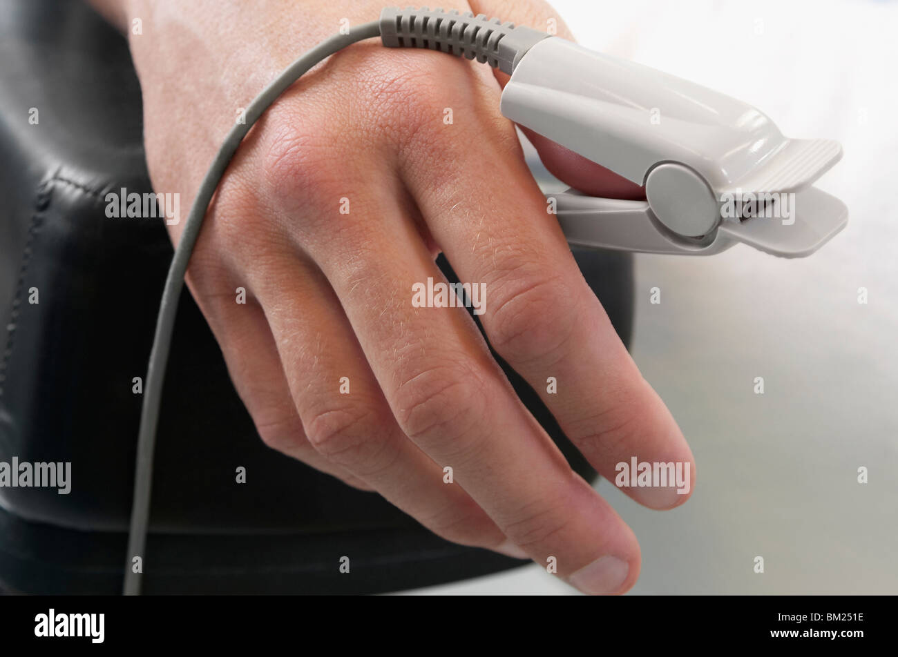 Patient's thumb with pulse oxymeter Stock Photo - Alamy