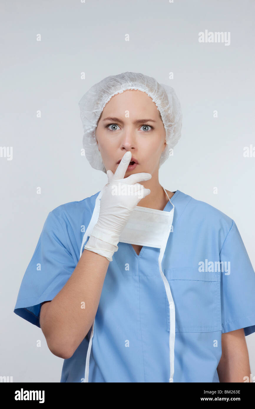 Portrait of a female surgeon looking surprised Stock Photo - Alamy