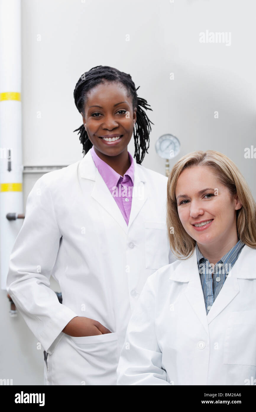 Portrait of two female doctors smiling in a laboratory Stock Photo - Alamy