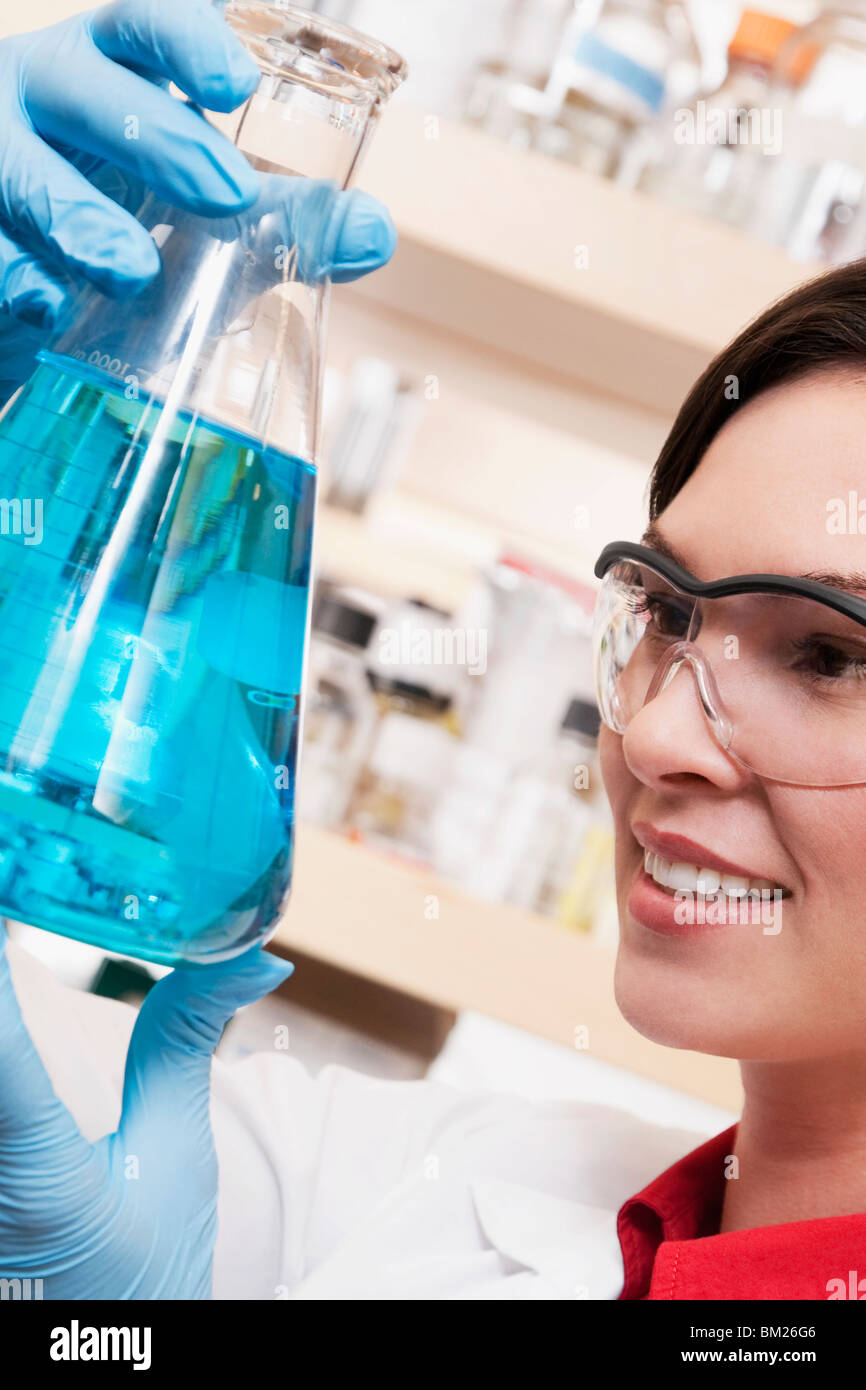 Female doctor holding a conical flask in a laboratory Stock Photo - Alamy