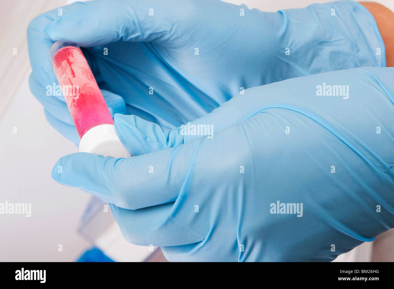 Doctor holding a medical sample in a laboratory Stock Photo - Alamy