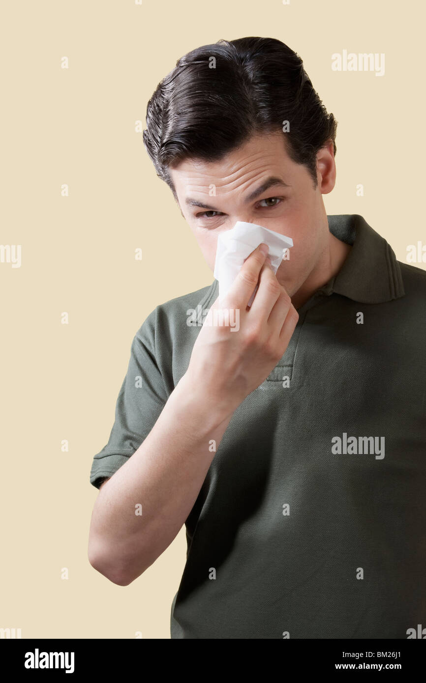 Cleaning nose with tissue paper hi-res stock photography and images - Alamy