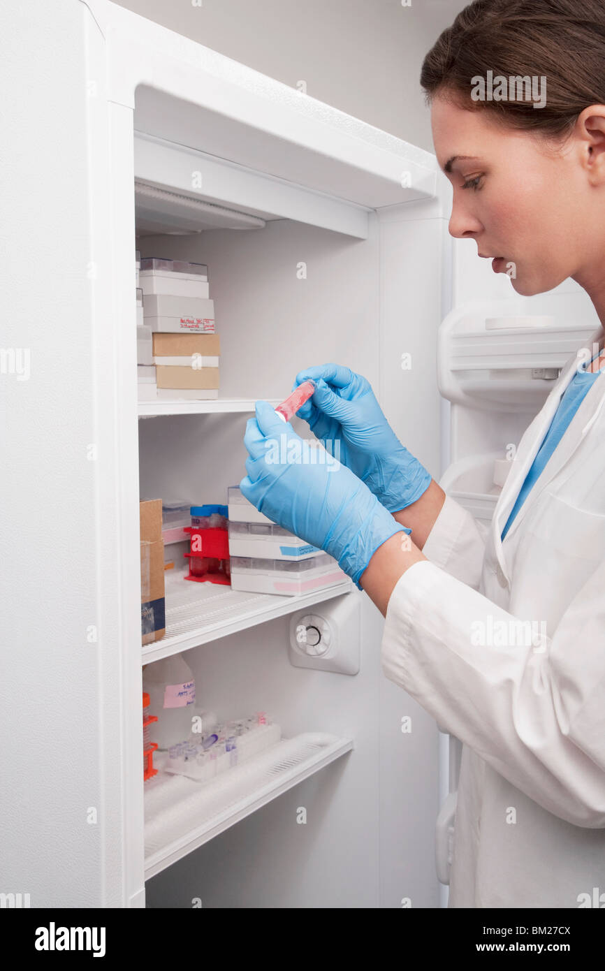 Female doctor holding a medical sample in a laboratory Stock Photo - Alamy