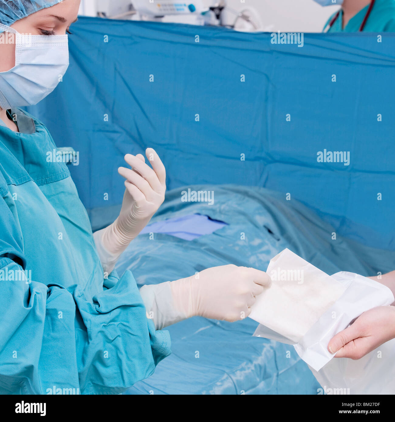 Two surgeons performing a surgery in an operating room Stock Photo - Alamy