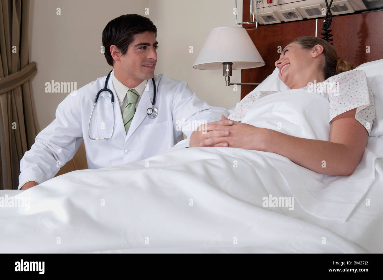 Doctor discussing with a patient Stock Photo - Alamy