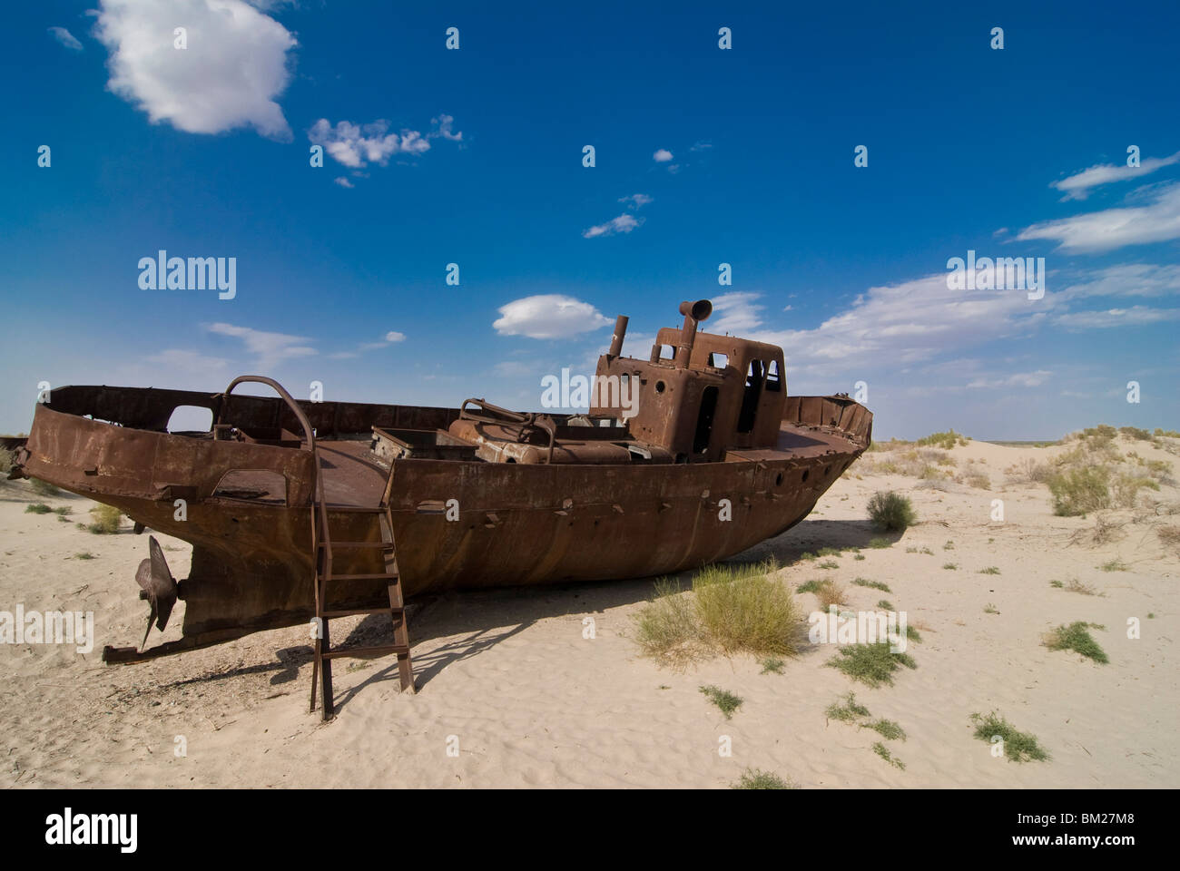 Rusting boats lying in the desert which used to be the Aral Sea, Moynaq ...