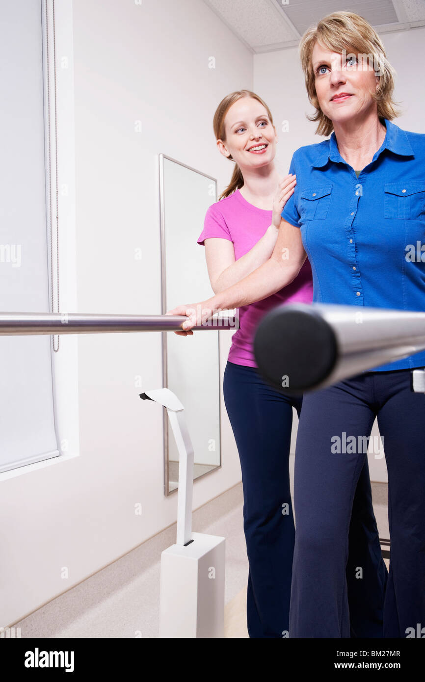 Physical therapist holding patient walking hi-res stock photography and ...