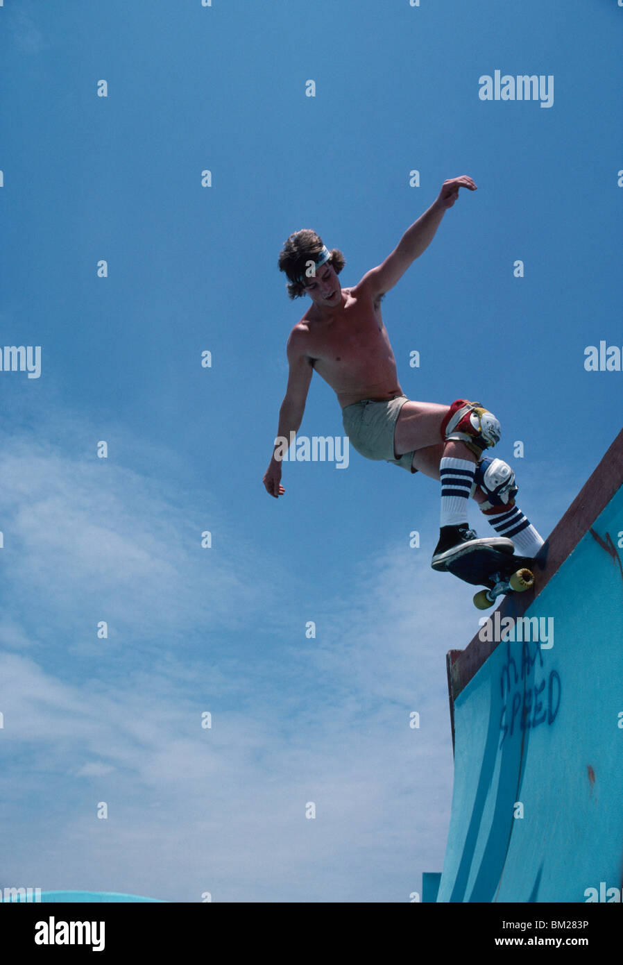 Skateboarder doing trick on halfpipe Stock Photo - Alamy