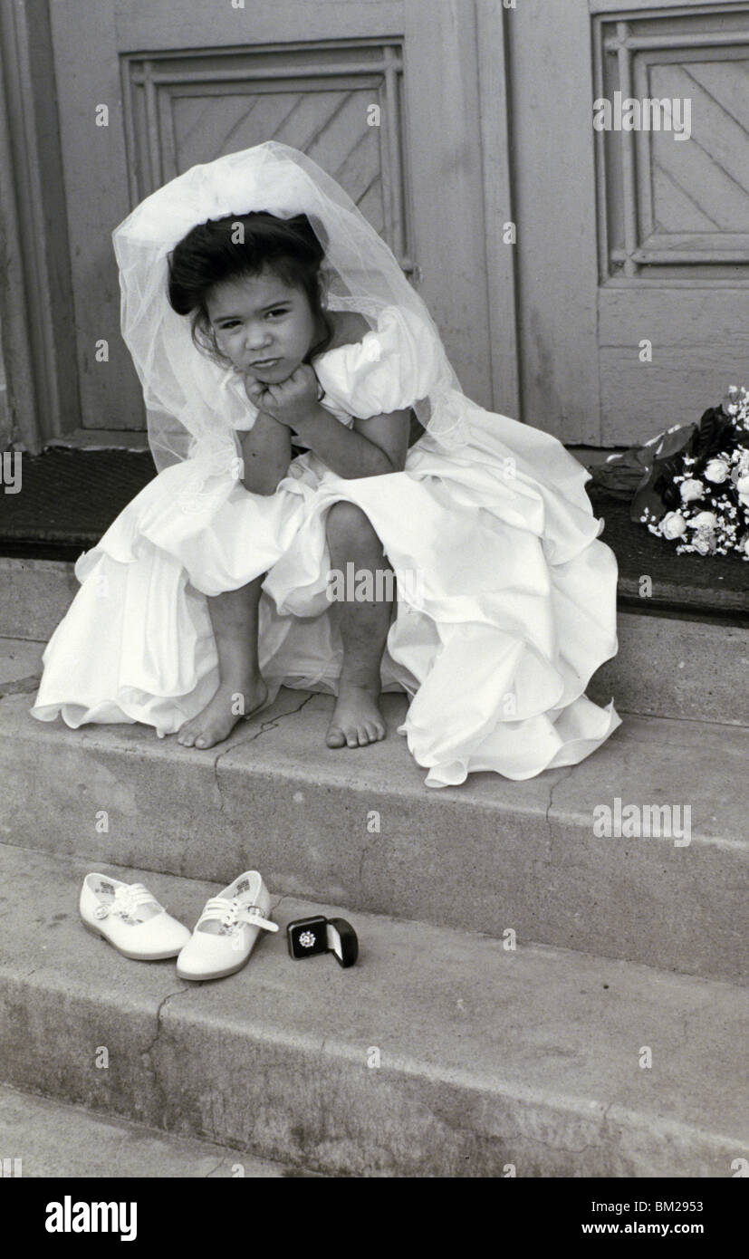 Flower girl sitting at steps Stock Photo - Alamy