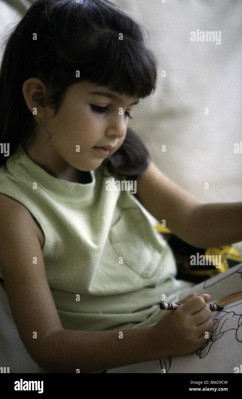 Close-up of a girl coloring a picture book Stock Photo - Alamy