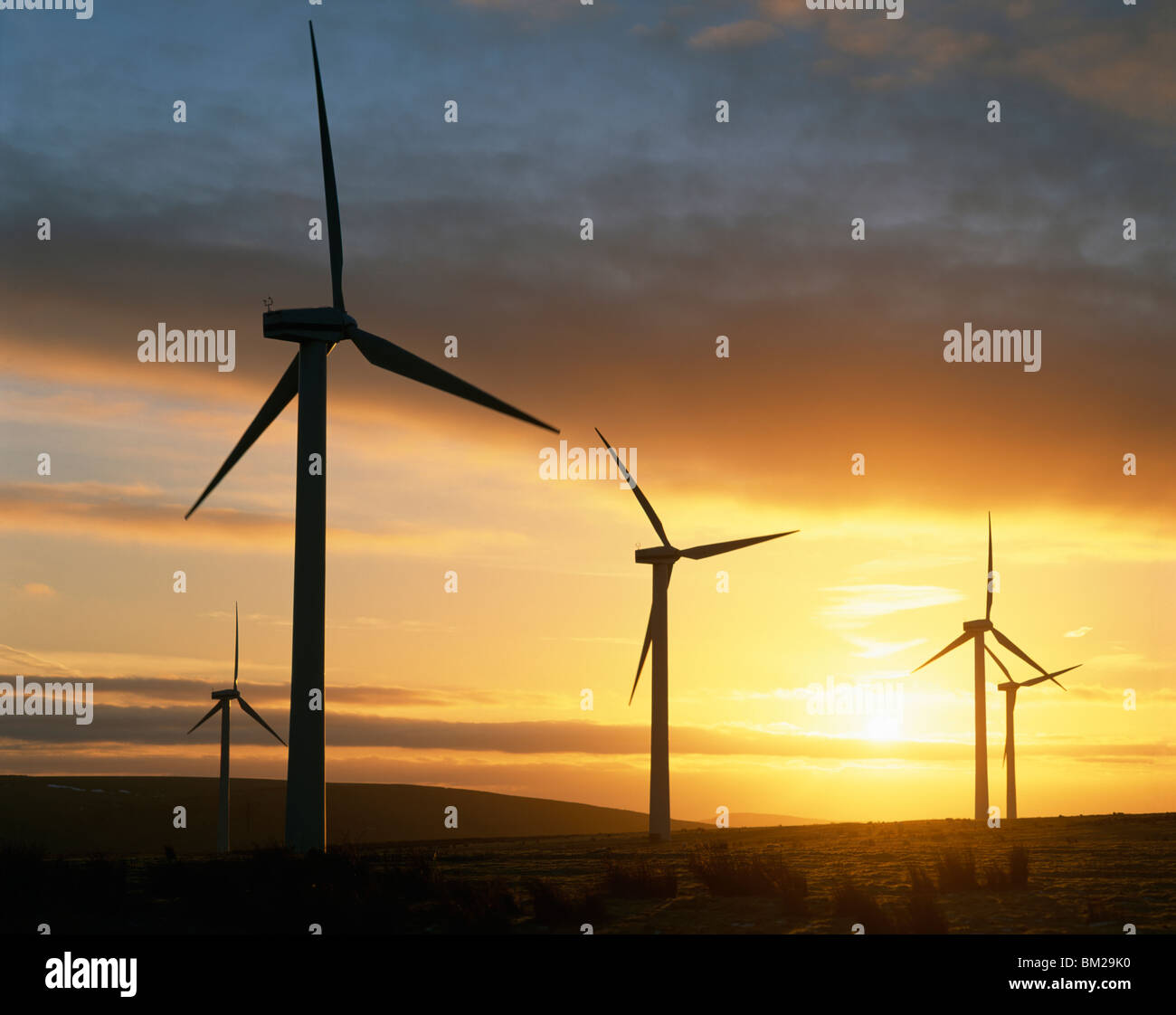 Wind turbines at sunset Stock Photo - Alamy