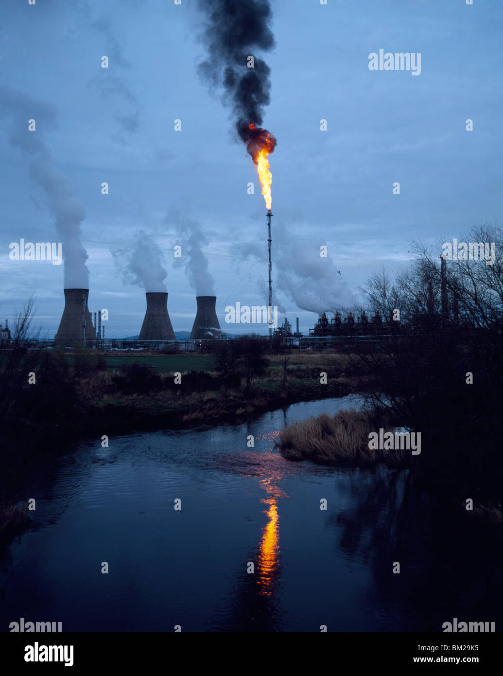 Smoke with flame emitting from an oil refinery, Scotland Stock Photo ...