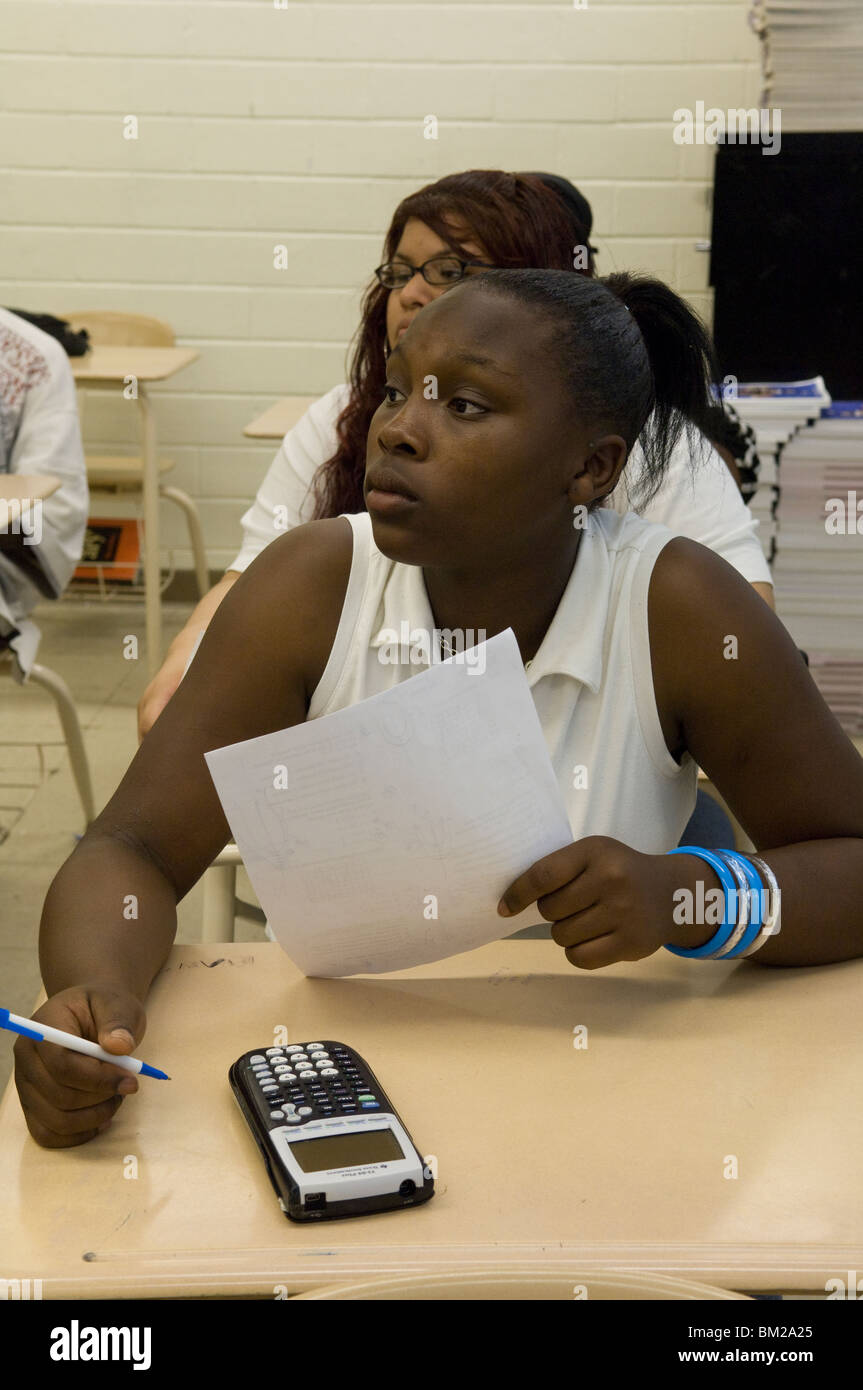 African-American female high school student with graphing calculator on ...